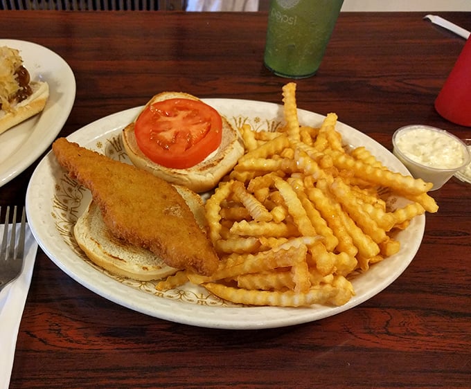 A golden-fried fish sandwich with crinkle-cut fries &ndash; proof that simplicity, when done right, outshines complexity every single time.