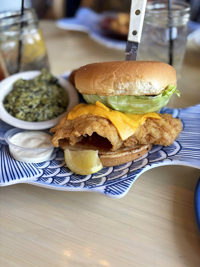 This fish sandwich isn't just lunch&mdash;it's architecture. Crispy fish, melty cheese, and fresh lettuce stacked with the precision of a delicious Jenga tower.