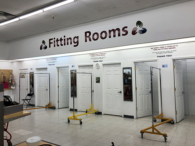 Fitting rooms provide privacy for trying on potential wardrobe additions with proper comfort.