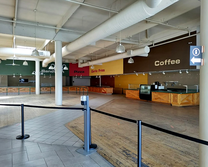 The food court stands ready for retail warriors needing refueling&mdash;note the "Garlic Fries" sign, a delicious reminder you're in Gilroy, California's garlic capital.