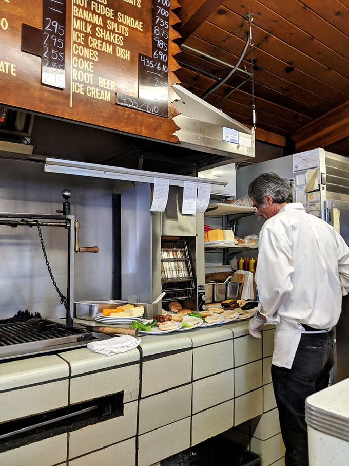 Where the magic happens. The grill master orchestrates a symphony of sizzling patties, ensuring each burger achieves that perfect char.