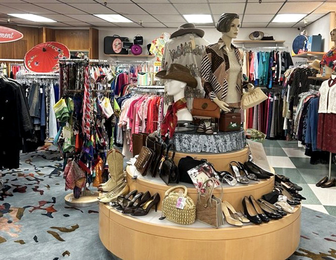 A mannequin holding court over a treasure trove of vintage accessories. Those handbags and shoes have danced through more interesting decades than ours.