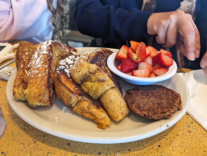 French toast that's crossed the line from breakfast to dessert, with strawberries adding that touch of "See? It's still healthy!"