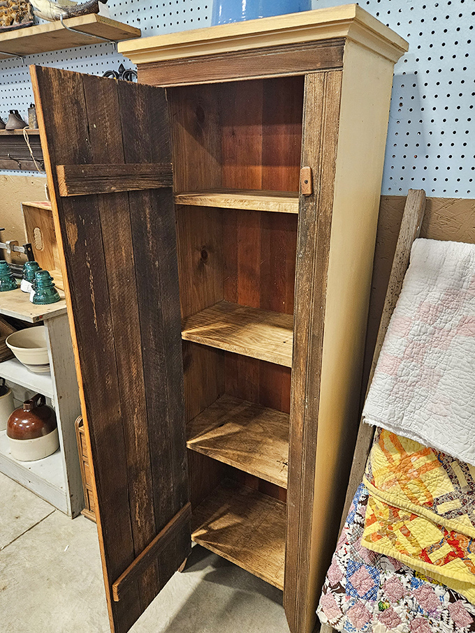 This rustic cabinet could tell tales of farmhouse kitchens and Sunday dinners. Solid wood craftsmanship that laughs at today's assembly-required furniture.