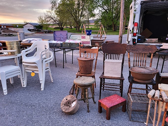 Outdoor vendor setup as the sun begins to set. The golden hour makes even plastic chairs look like they belong in a museum of everyday Americana.