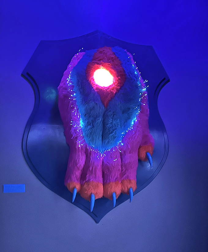 This mounted creature appears to be the trophy of some intergalactic big game hunter with a fondness for neon.