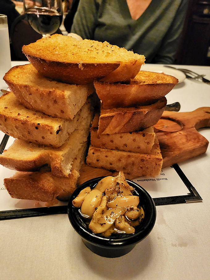 Garlic bread stacked like a carb-lover's Jenga game. One bite of this buttery, garlicky tower and you'll forget all about that low-carb nonsense.