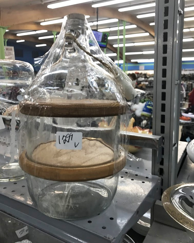 A glass jar with endless possibilities. Once held someone's pickles, now ready for your homemade pasta, decorative marbles, or loose change collection.