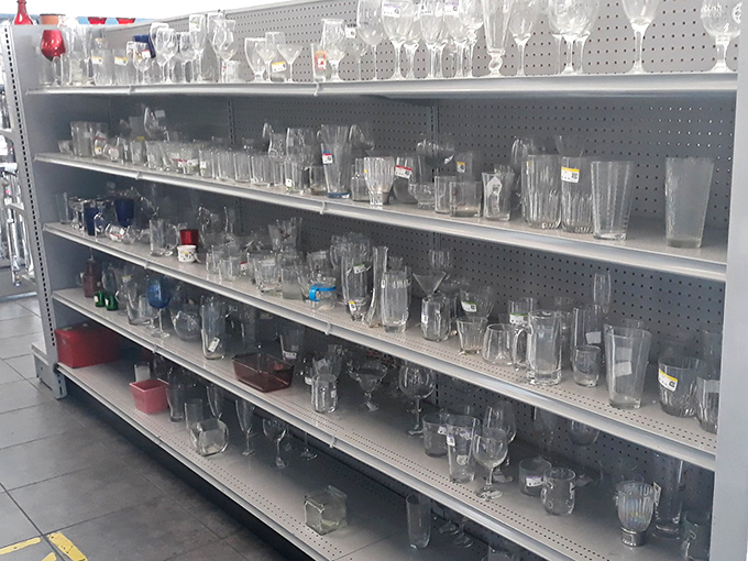 The glassware aisle: a crystal wonderland where you can assemble a mismatched collection that somehow looks intentionally curated when guests arrive.