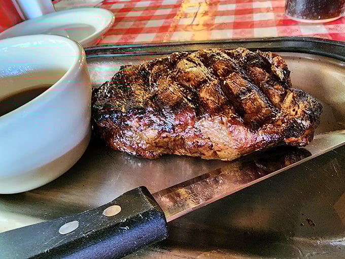 A perfectly grilled steak with those coveted crosshatch marks proves that sometimes the simplest preparations yield the most satisfying results.
