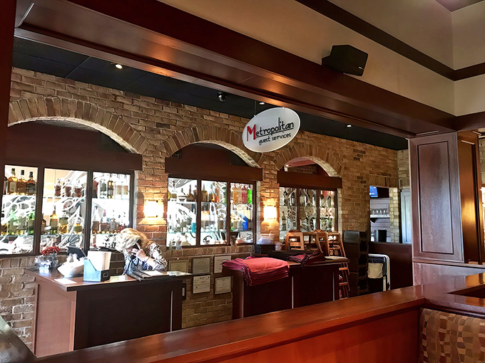 The Metropolitan's interior design balances modern elegance with homey comfort. Those brick archways frame the bar like a portal to culinary happiness.