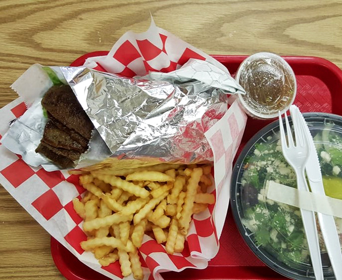 A gyro platter that makes you wonder why you ever eat anything else, complete with fries and a side salad for those who appreciate balance.