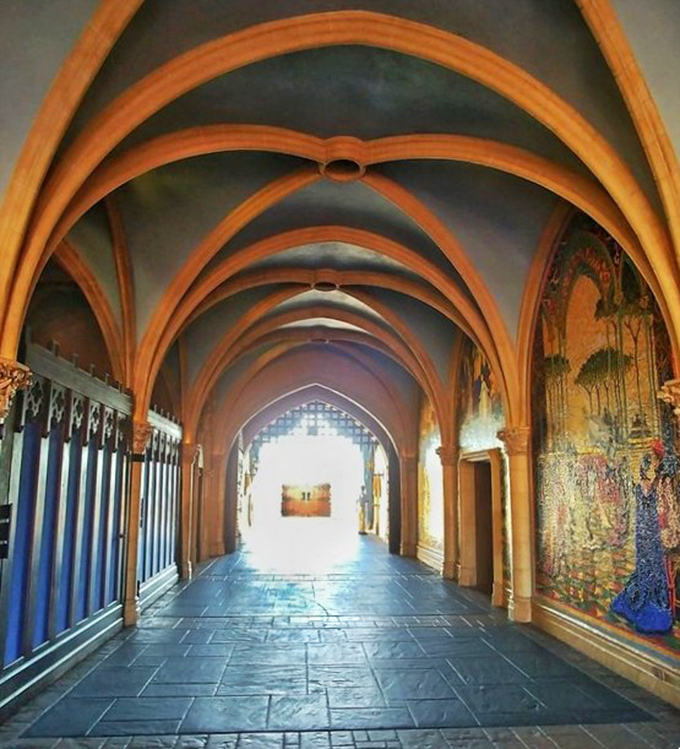 The castle's interior passageway reveals medieval-inspired architecture and stunning mosaics that most visitors rush past without noticing.