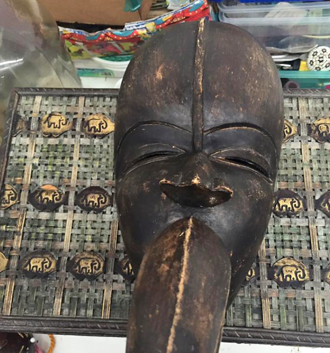 This carved wooden mask didn't expect to end up in Georgia, yet here it waits for an appreciative new home.