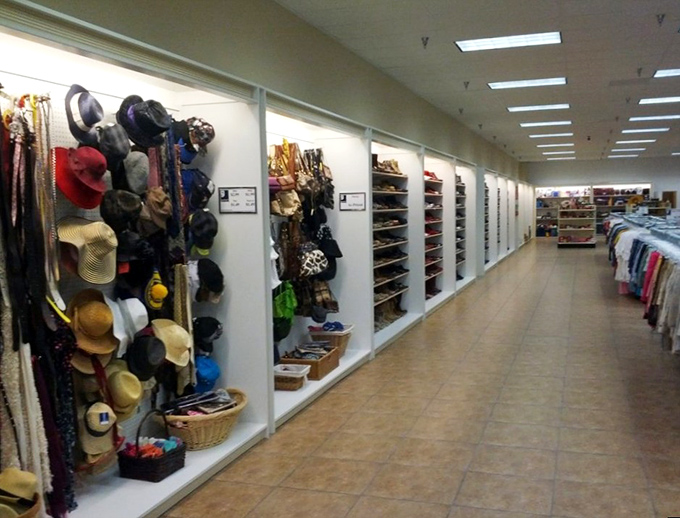 The accessories wall showcases hats and handbags from every era. Channel your inner Audrey Hepburn with that wide-brimmed summer hat.