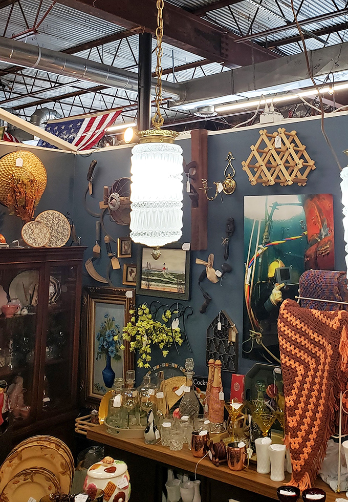 A hanging pendant light illuminates an eclectic wall display that screams "I didn't get this at a big box store!"