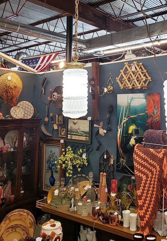 A hanging pendant light illuminates an eclectic wall display that screams "I didn't get this at a big box store!"