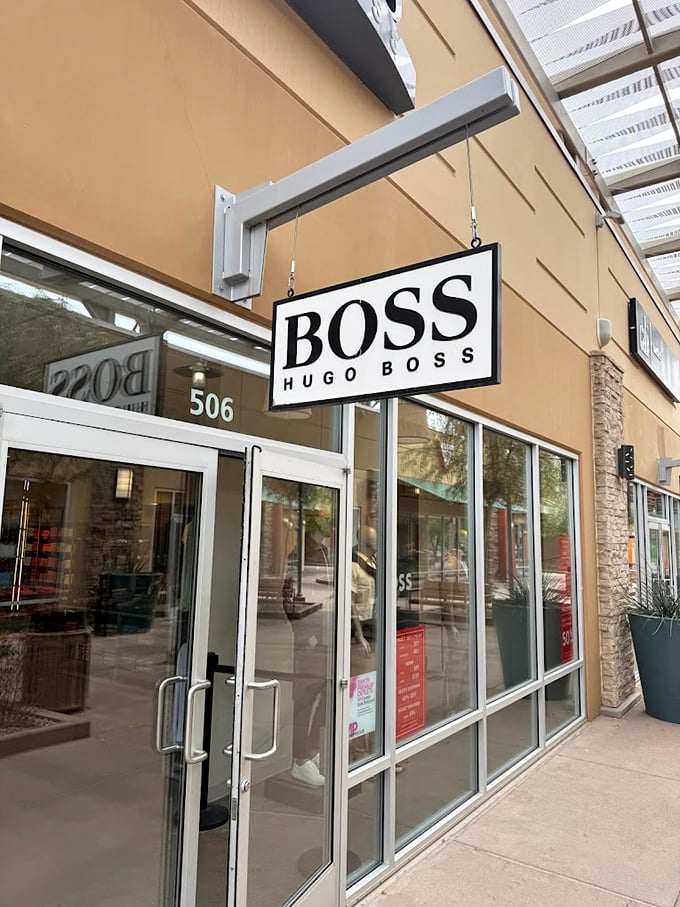 Hugo Boss beckons with minimalist elegance, offering sophisticated menswear that says "I'm successful" without shouting "I paid full price."