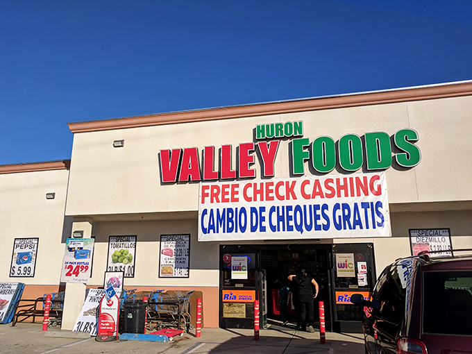 Huron Valley Foods serves the community with bilingual signage reflecting the town's rich cultural diversity and agricultural heritage.