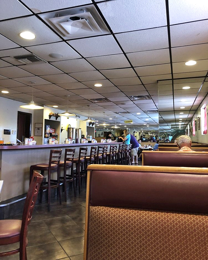 The dining room stretches out like a breakfast kingdom, with each booth a potential throne for hungry patrons seeking morning glory.