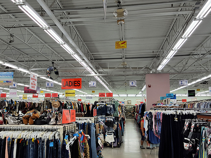 The overhead view reveals the magnificent scale of this secondhand empire. Those hanging signs are the treasure map to your next great find.