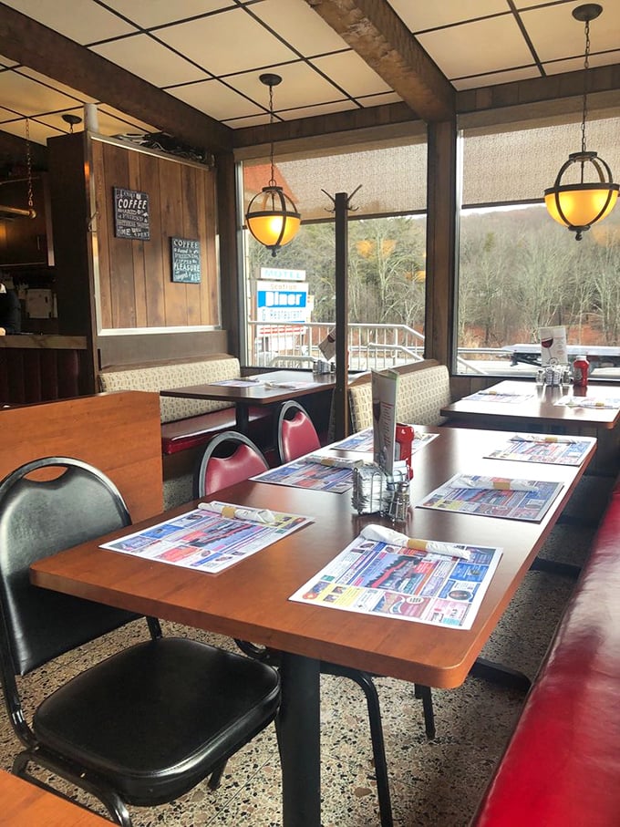Warm wood paneling and globe lights create that perfect "remember when restaurants felt like this?" atmosphere we all crave.