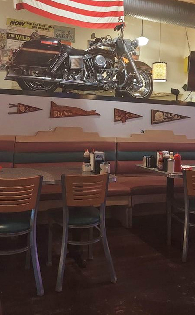 A Harley-Davidson mounted above booths? Now that's commitment to Americana that goes beyond the expected diner pennants and memorabilia. 