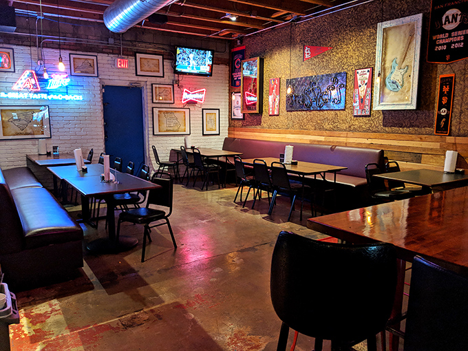 Neon signs cast a warm glow over wooden tables. The perfect setting for the serious business of enjoying exceptional BBQ.