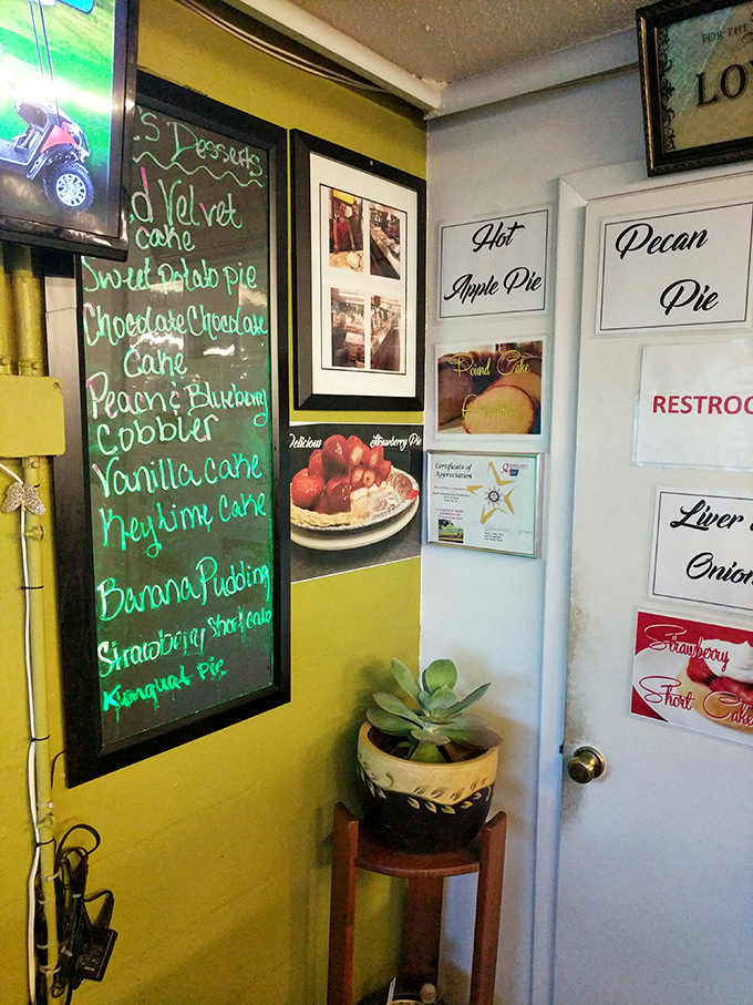 The dessert board reads like poetry: Red Velvet Cake, Peach Cobbler, Banana Pudding. Some people plan their entire visit around what's written on this magical chalkboard.