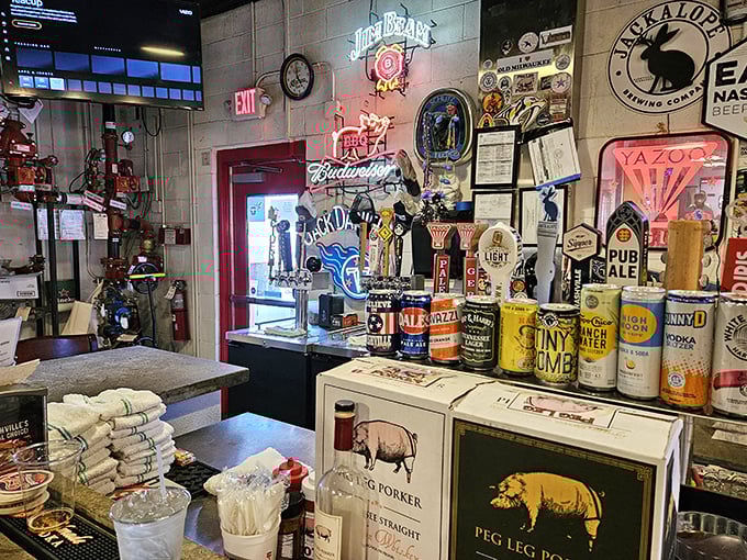 The wall of fame showcases beer signs and barbecue accolades&mdash;a museum of good times where neon glows like smoky halos.