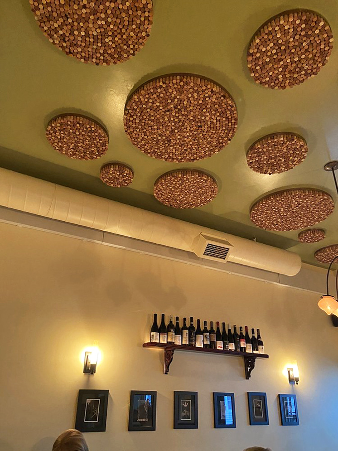 Copper ceiling medallions catch the light, creating a warm glow that makes everyone look like they've returned from an Italian vacation.