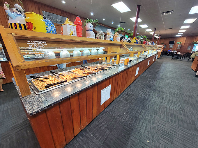 The buffet stretches into the distance like a food mirage, but pinch yourself—those steam trays of Southern classics are gloriously real.