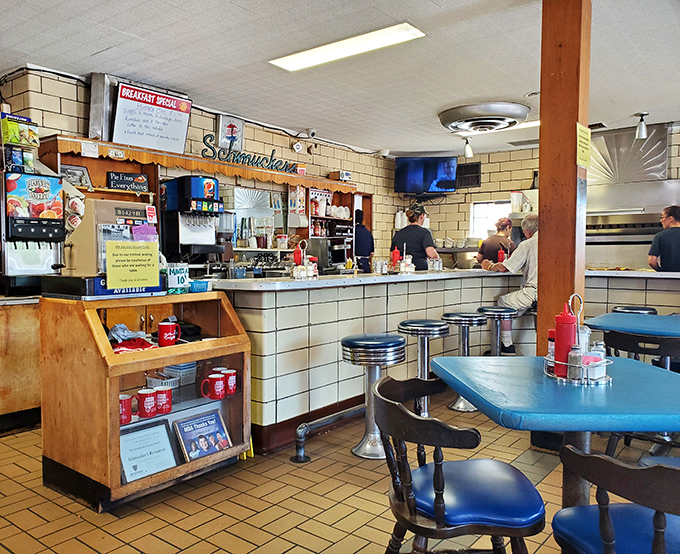 The counter view reveals the heart of operations &ndash; where coffee is poured, orders are called, and regulars claim their rightful stools.