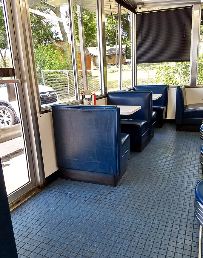 Classic blue booths bathed in natural light create the perfect setting for conversations that matter and meals you'll remember long after the check arrives.