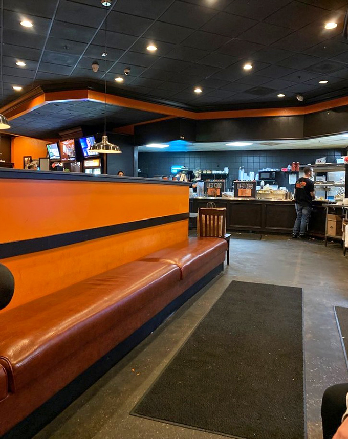 The diner's warm orange tones and comfortable seating create the perfect backdrop for the food drama about to unfold on your plate.