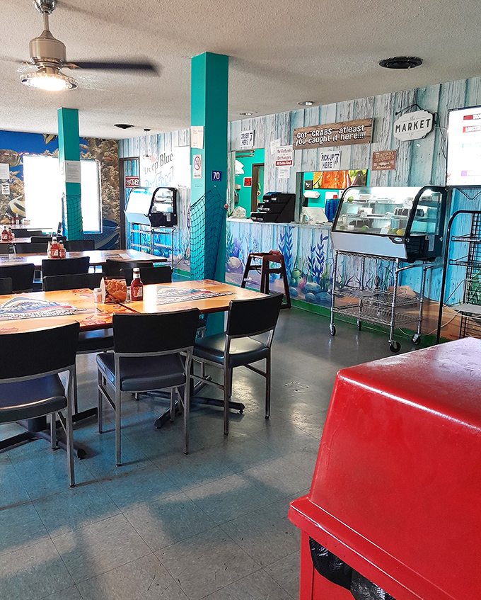 The dining area balances casual comfort with coastal charm. That seafood counter in the back hints at the freshness awaiting your order.