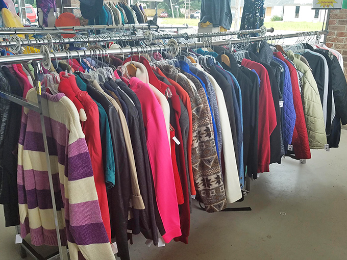 A rainbow of second chances hanging neatly in a row. That perfect jacket is hiding here, just waiting for you to discover it.