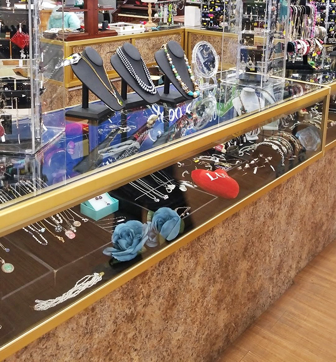 The jewelry counter gleams with possibility &ndash; someone's forgotten accessories becoming another's statement piece.