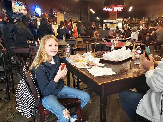 Creating barbecue memories that will last a lifetime. This young diner is experiencing the joy that comes from real, honest-to-goodness Texas barbecue.
