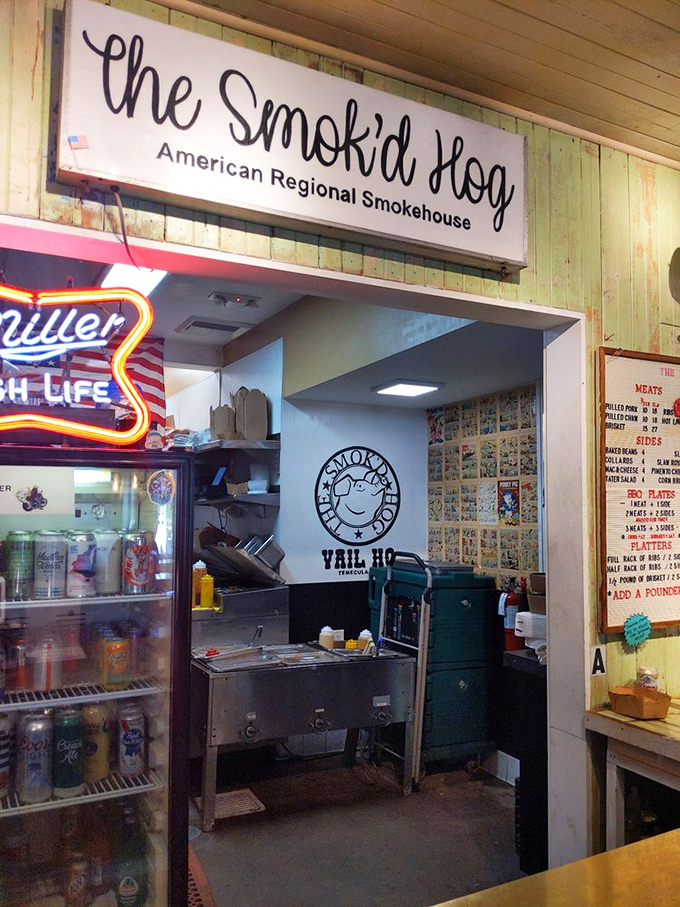 The kitchen pass-through—where smoke-kissed treasures emerge to meet their destiny on your plate. Anticipation builds with every order.