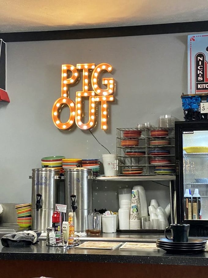 That "PIG OUT" sign isn't just cute decor&mdash;it's a mission statement. Behind the counter, Nick's colorful plates wait to carry their precious cargo to hungry patrons.