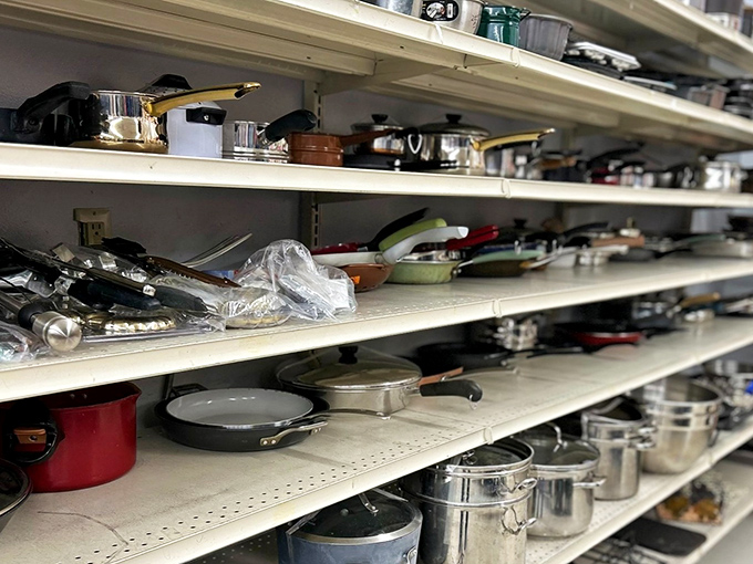 The kitchenware section offers pots and pans that have served countless family dinners. That red saucepan has probably witnessed more cooking dramas than Food Network.