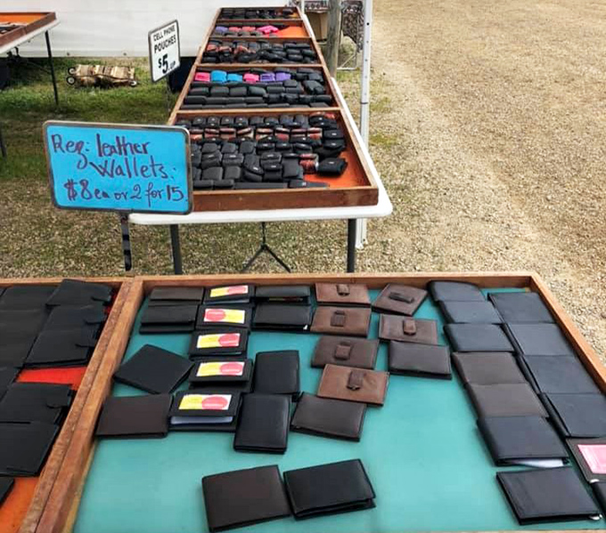 Leather wallets spread like playing cards, each one promising to hold your money better than you do.