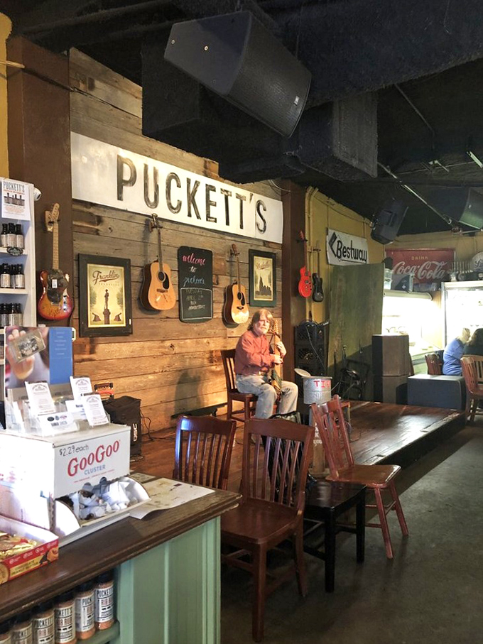 Where music and meals create memories &ndash; acoustic guitars hang like promises on wooden walls, waiting for the next performer to soundtrack your dinner.