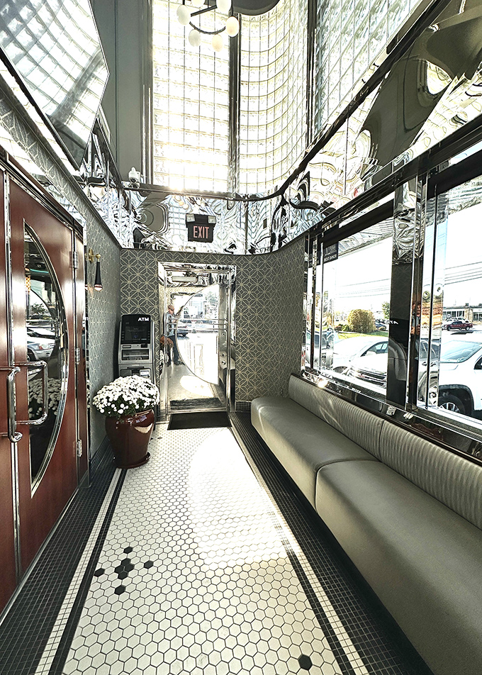 The entrance hallway gleams with enough chrome and glass to make you feel like you're walking into a 1950s vision of the future.