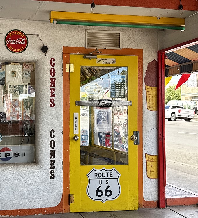This yellow door has welcomed road-weary travelers for decades, promising cold drinks, hot food, and dad jokes that never go out of style.