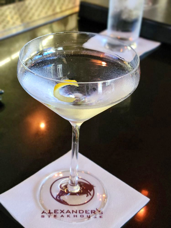 Classic martini with lemon twist - sometimes the most sophisticated cocktails are the ones that never go out of style.
