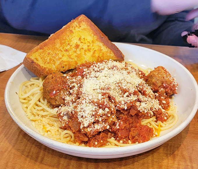 Spaghetti and meatballs with garlic toast &ndash; the kind of plate that makes you want to kiss your fingers like an Italian grandmother just taught you something important.