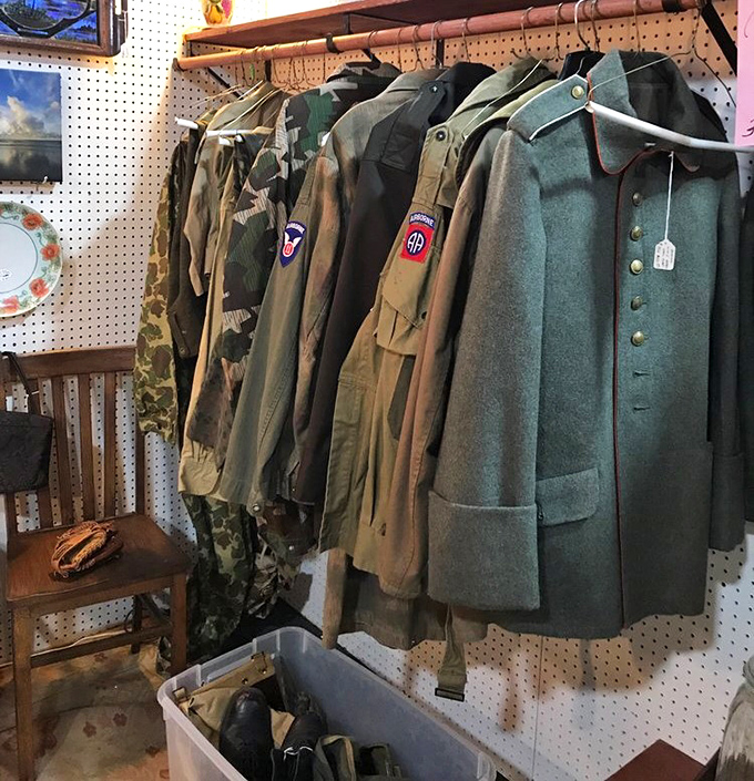 Military uniforms stand at attention, each patch and button telling stories of service that span generations and conflicts most only read about.