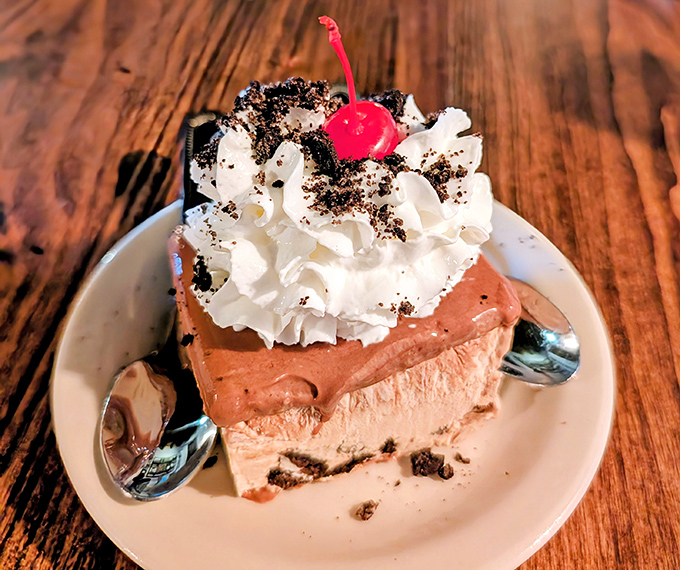 This isn't just chocolate pie&mdash;it's a towering achievement of cream, cookie crumbles, and that perfectly positioned cherry on top.